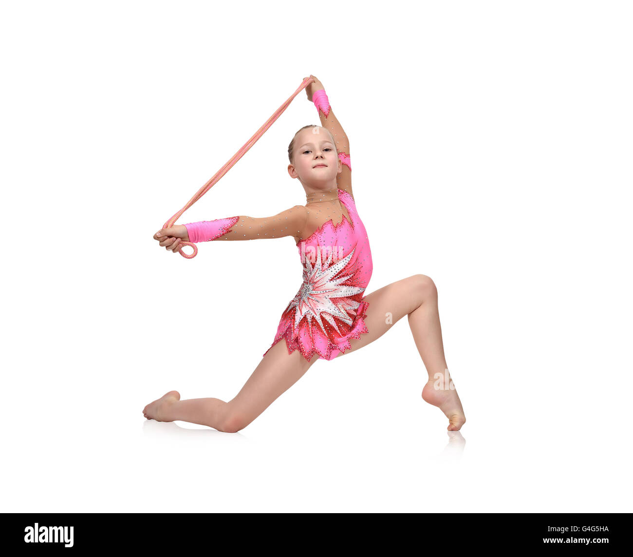 girl with skipping rope doing gymnastics on white background Stock ...