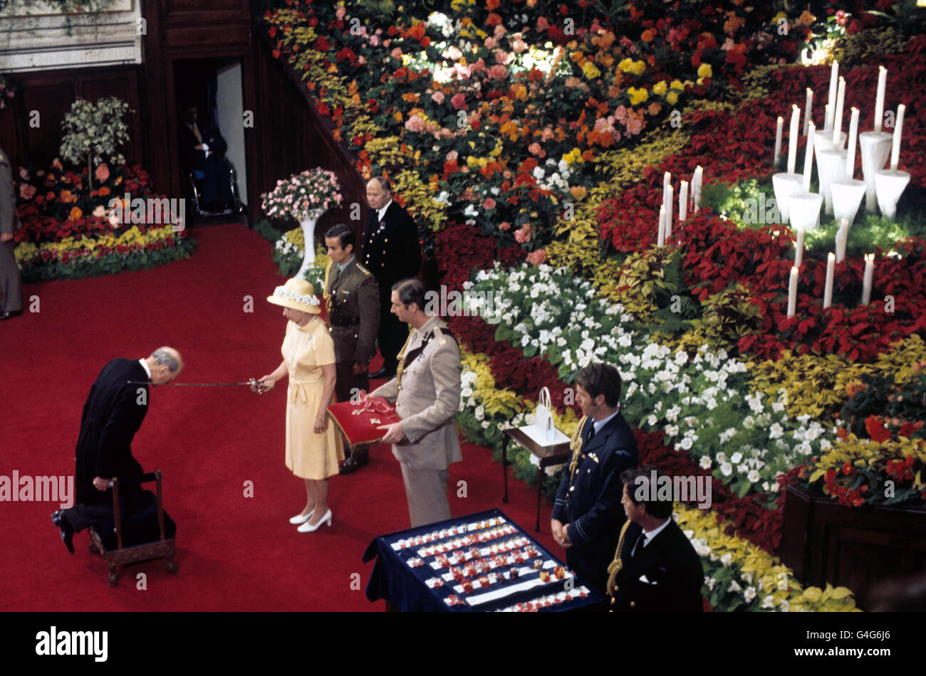 Queen Elizabeth II dubbing Dr Charles Alexander Fleming, of Wellington ...