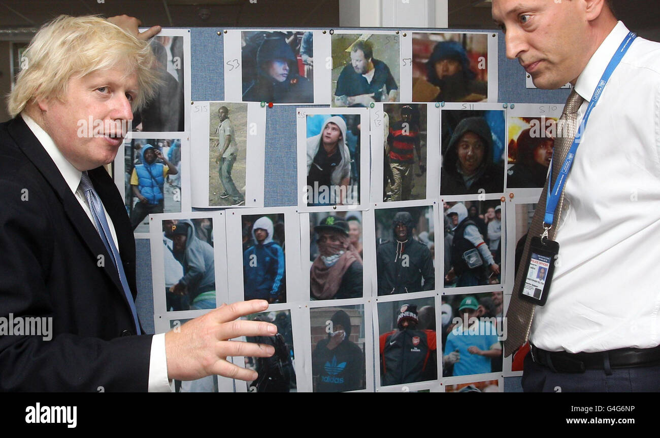 London Mayor Boris Johnson visits a Police CCTV Investigation Unit at ...