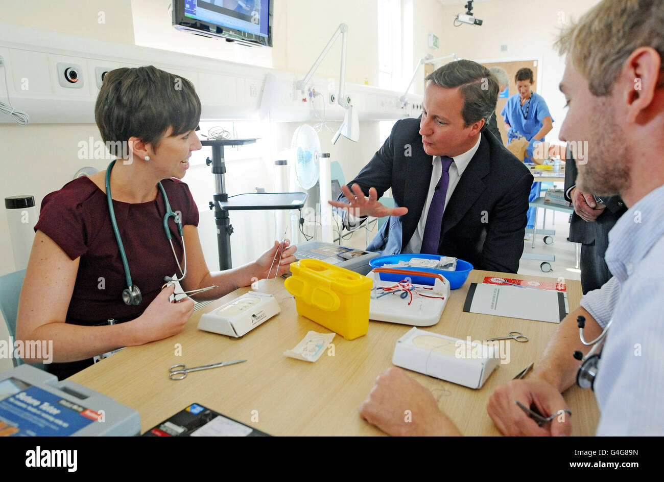 Prime Minister David Cameron (centre) chats to Dr Candice Downey (left ...
