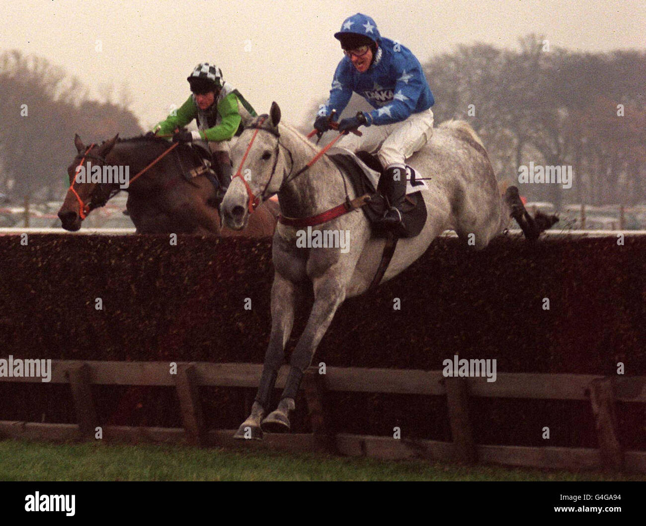 Suny Bay and Graham Bradley (right) take the last fence on their way to ...