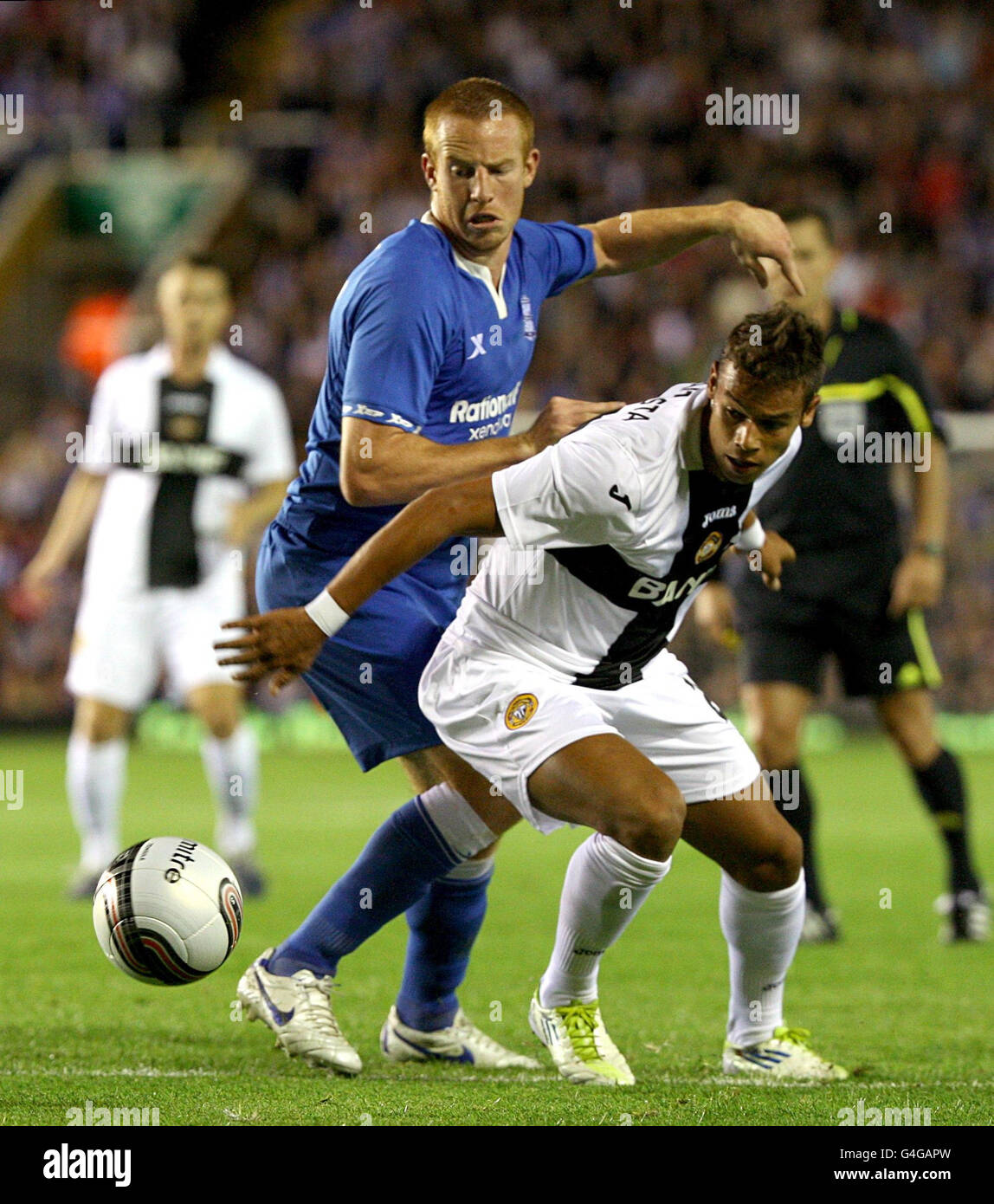 Birmingham City's Adam Rooney (left) and Nacional's Jose Edgar Costa ...