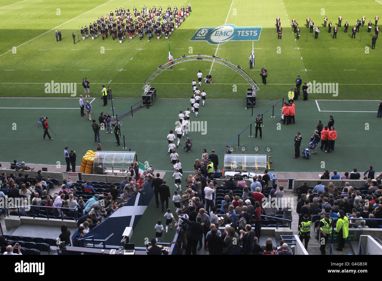 The matchday mascots take to the field before the game Stock Photo - Alamy