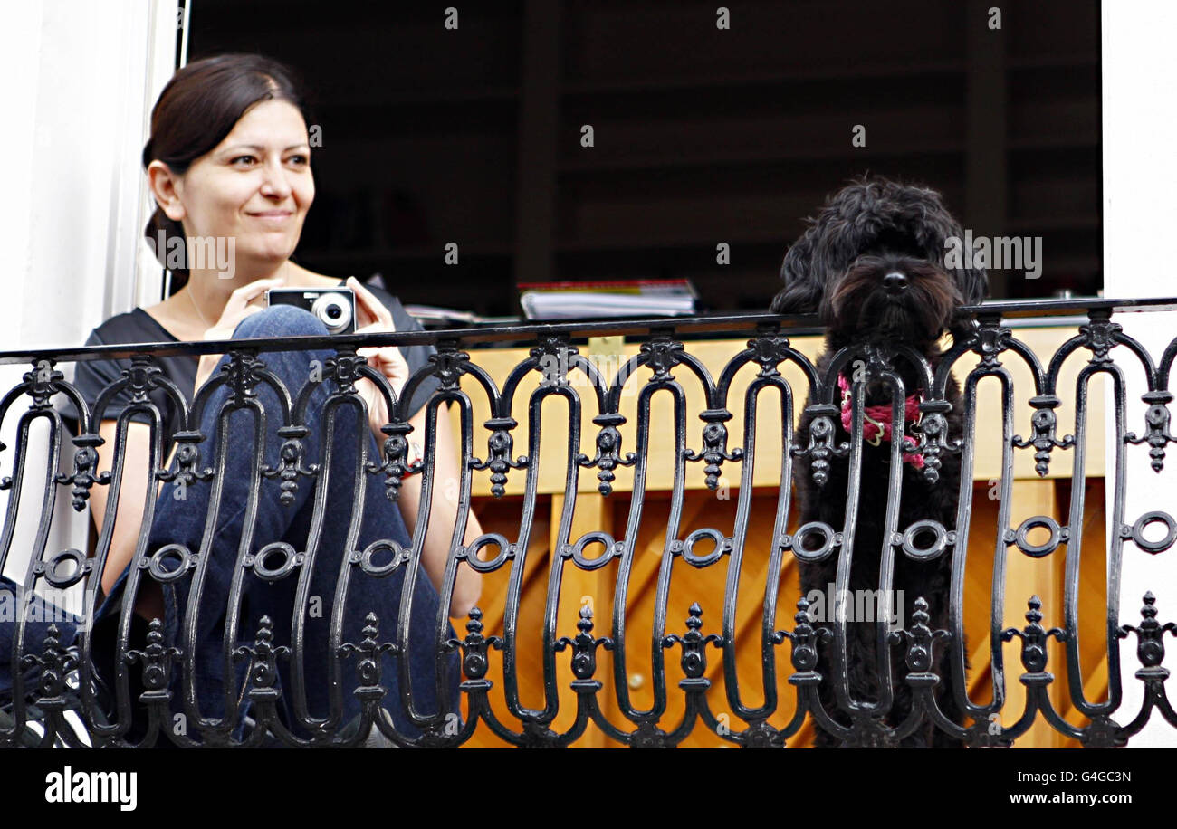 A woman and her dog looking at the parade at the Notting Hill carnival ...