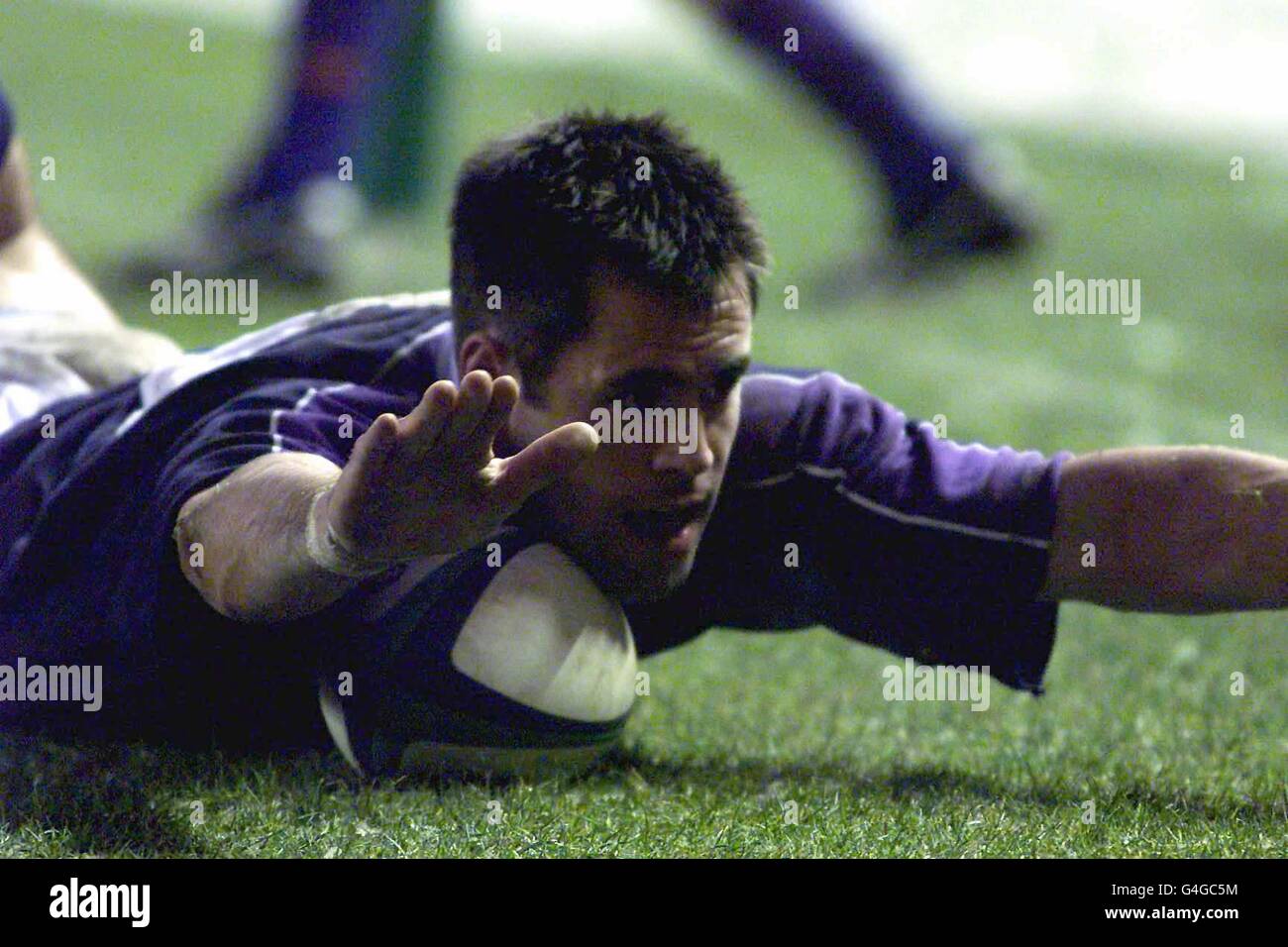 Scotland's Kenny Logan crosses the line to score another try against ...