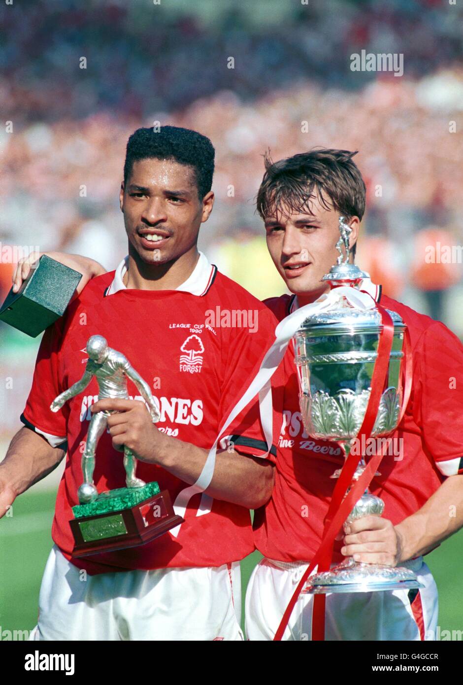 Celebration winners trophy miniature football hi-res stock photography ...