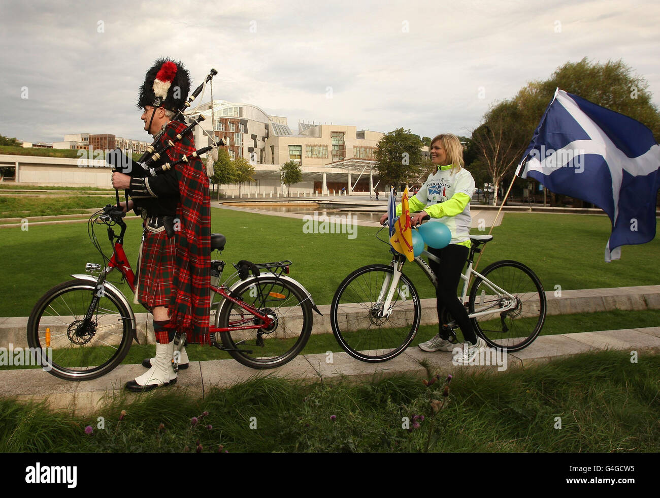 Piper Hugh Ward and Natalie Hoy join a group of cyclists departing on a ...
