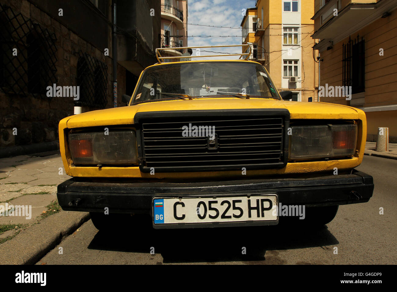 Bright yellow lada car parked on street in sofia hi-res stock ...