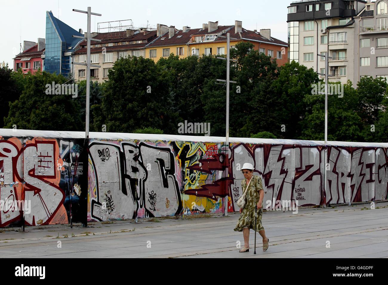 A woman walks past graffiti in Bulgaria Square in Sofia, Bulgaria Stock ...