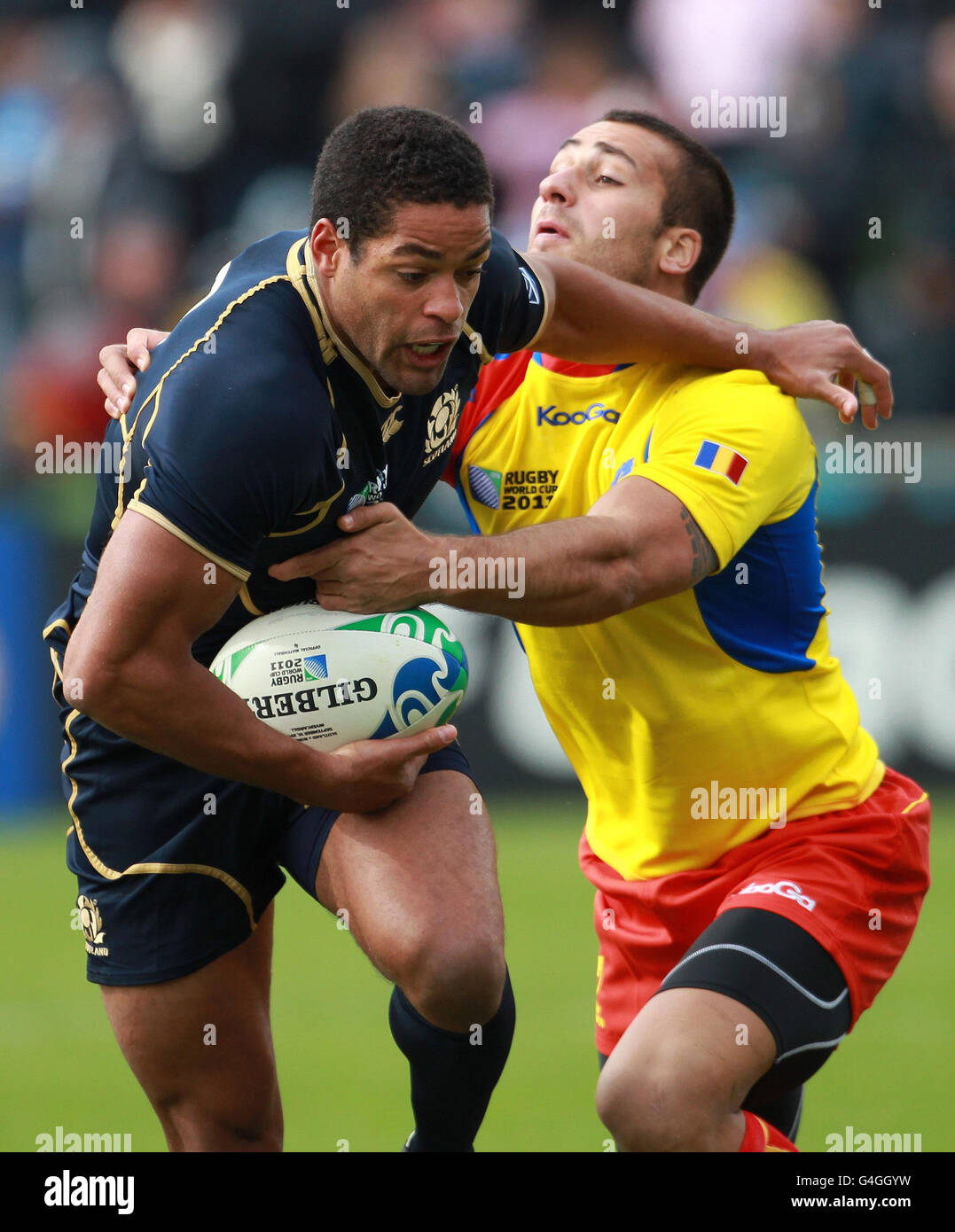 Scotland's Joe Ansbro and Romania's Lucian Sirbu during the IRB Rugby ...
