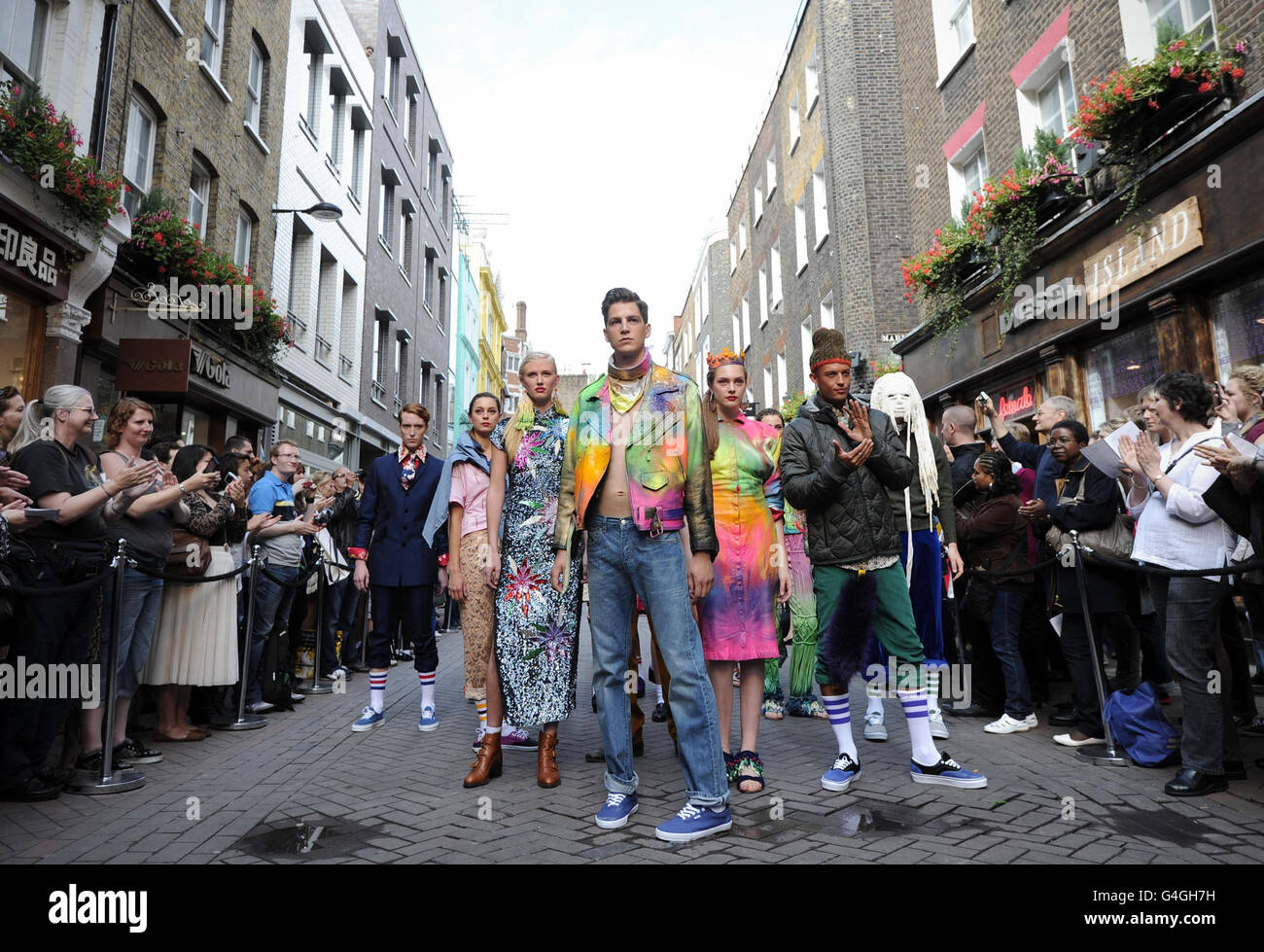 Models wear outfits styled by John William during the open air catwalk ...