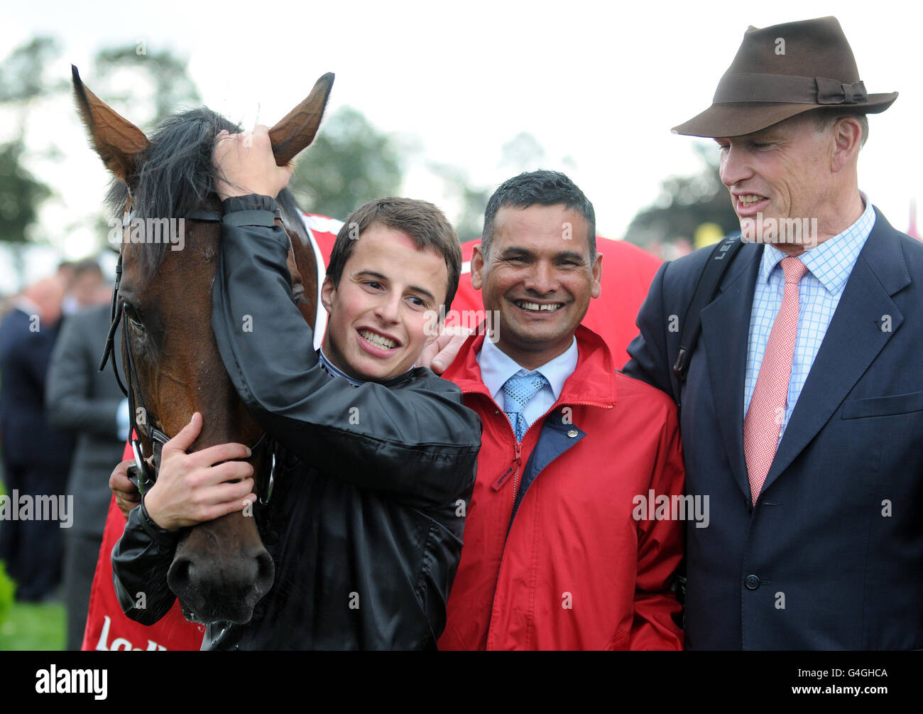 Jockey William Buick celebrates with Masked Marvel, stable hand Amir ...