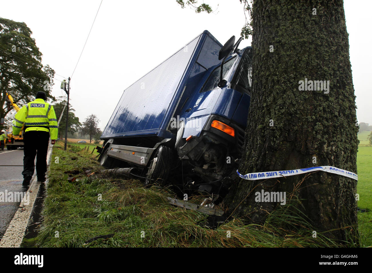 A BT engineer works to replace a fallen telegraph pole on the A811 near ...