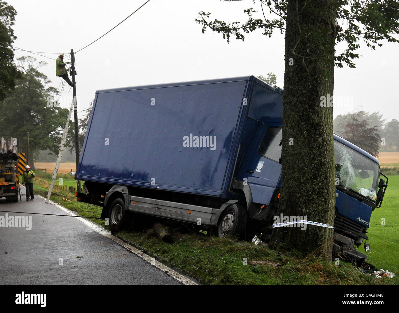 A BT engineer works to replace a fallen telegraph pole on the A811 near ...