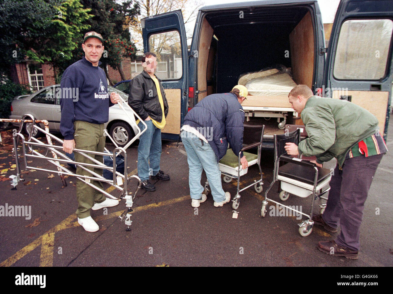 QPR (Queen's Park Rangers) coach and actor Vinnie Jones, (left) loads ...