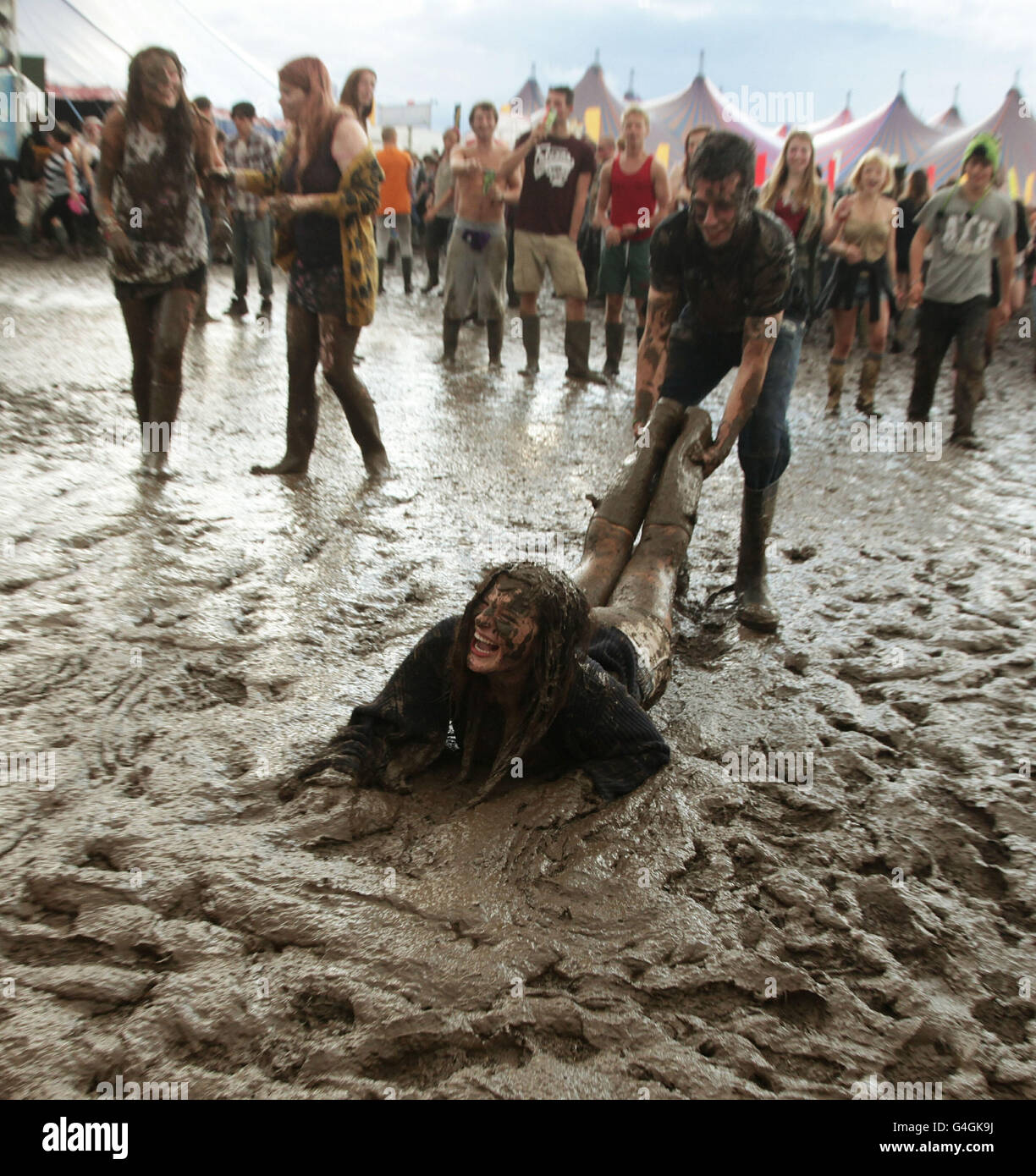 Festival goer katherine vincent dragged around in mud reading festival ...