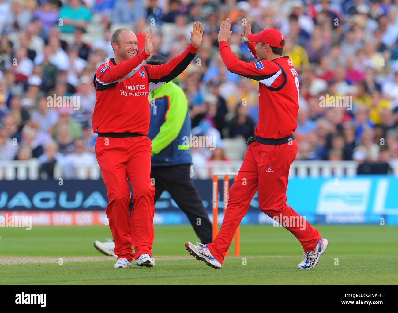 Lancashire Lightning's Gary Keedy (left) celebrates taking the wicket ...