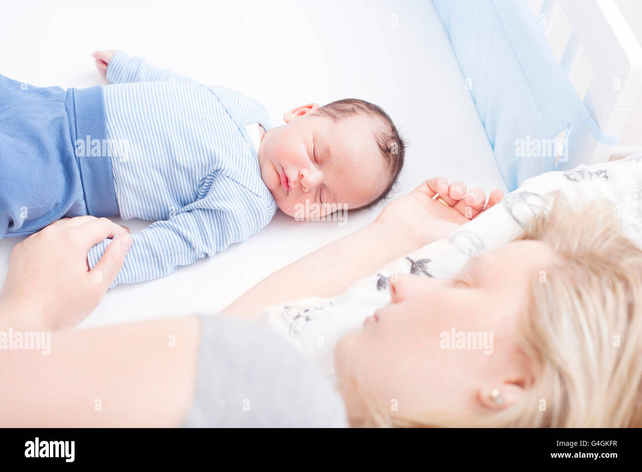 Caucasian newborn sleeping tight mom hi-res stock photography and ...