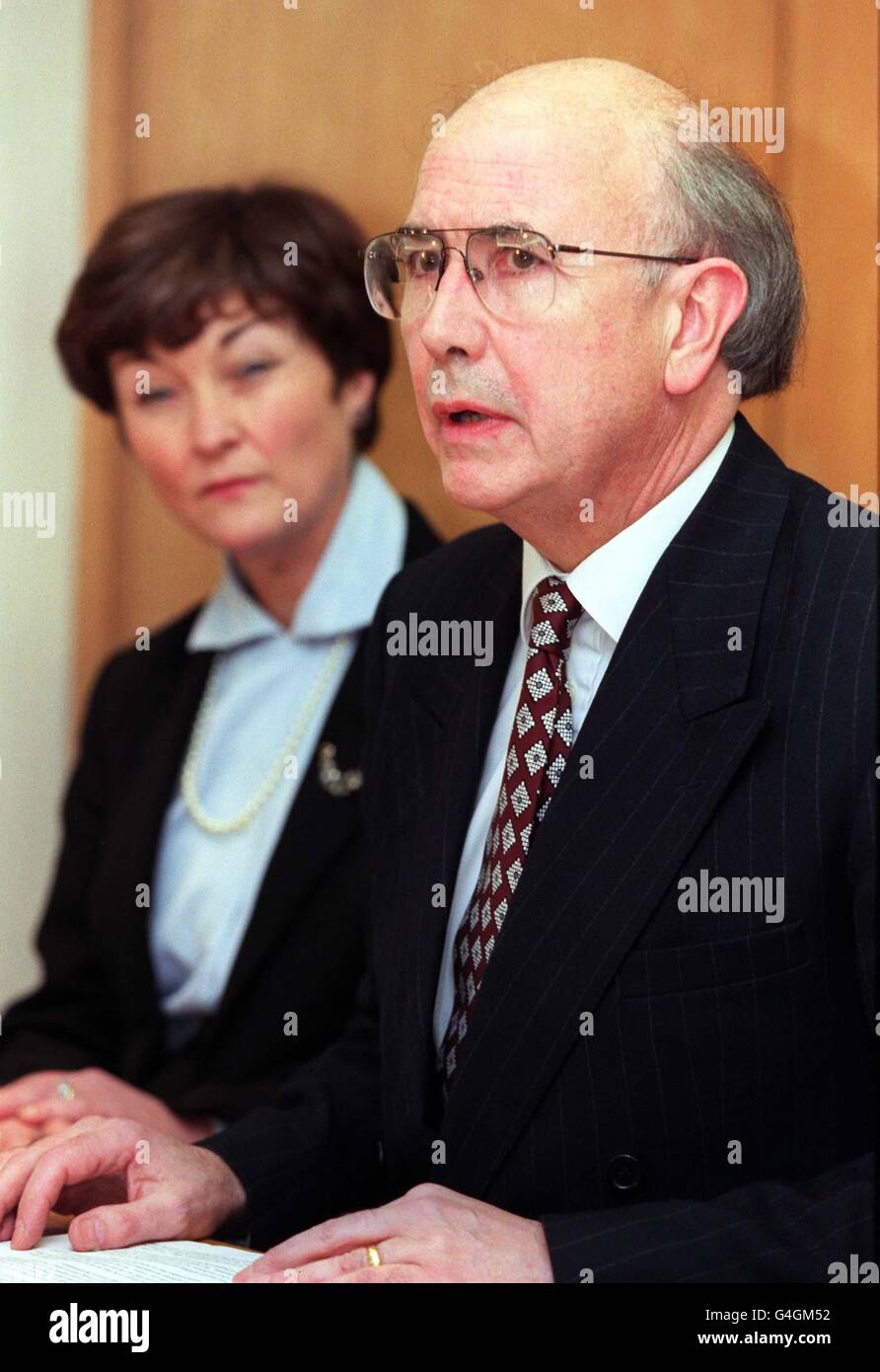 Dr Martin Neary and his wife, Penelope, speak to the media in London ...