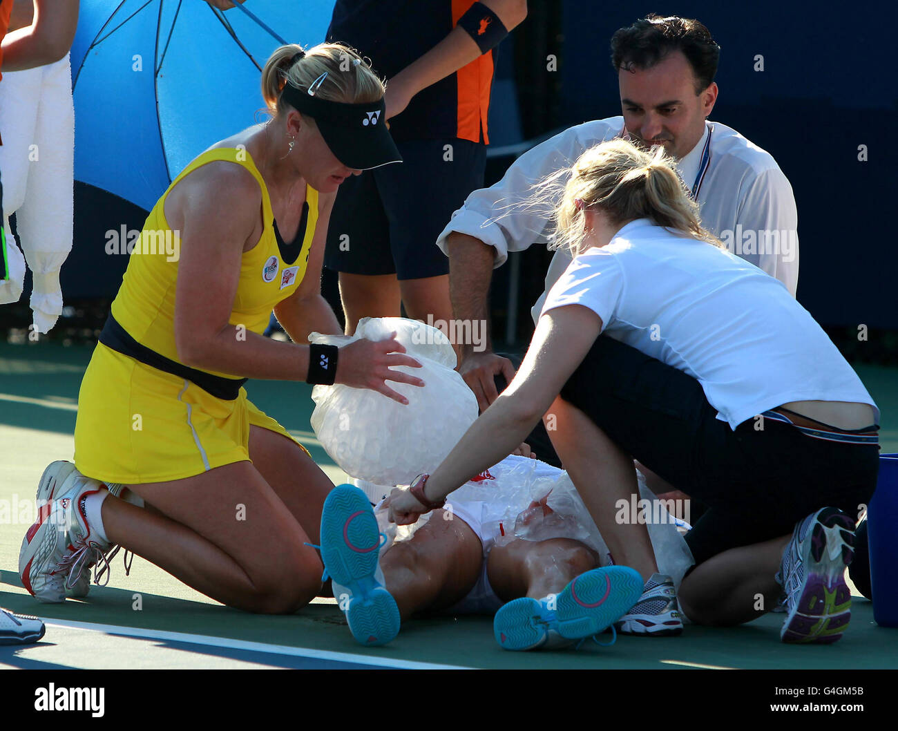Great Britain's Elena Baltacha helps USA's Jamie Hampton who collapsed ...