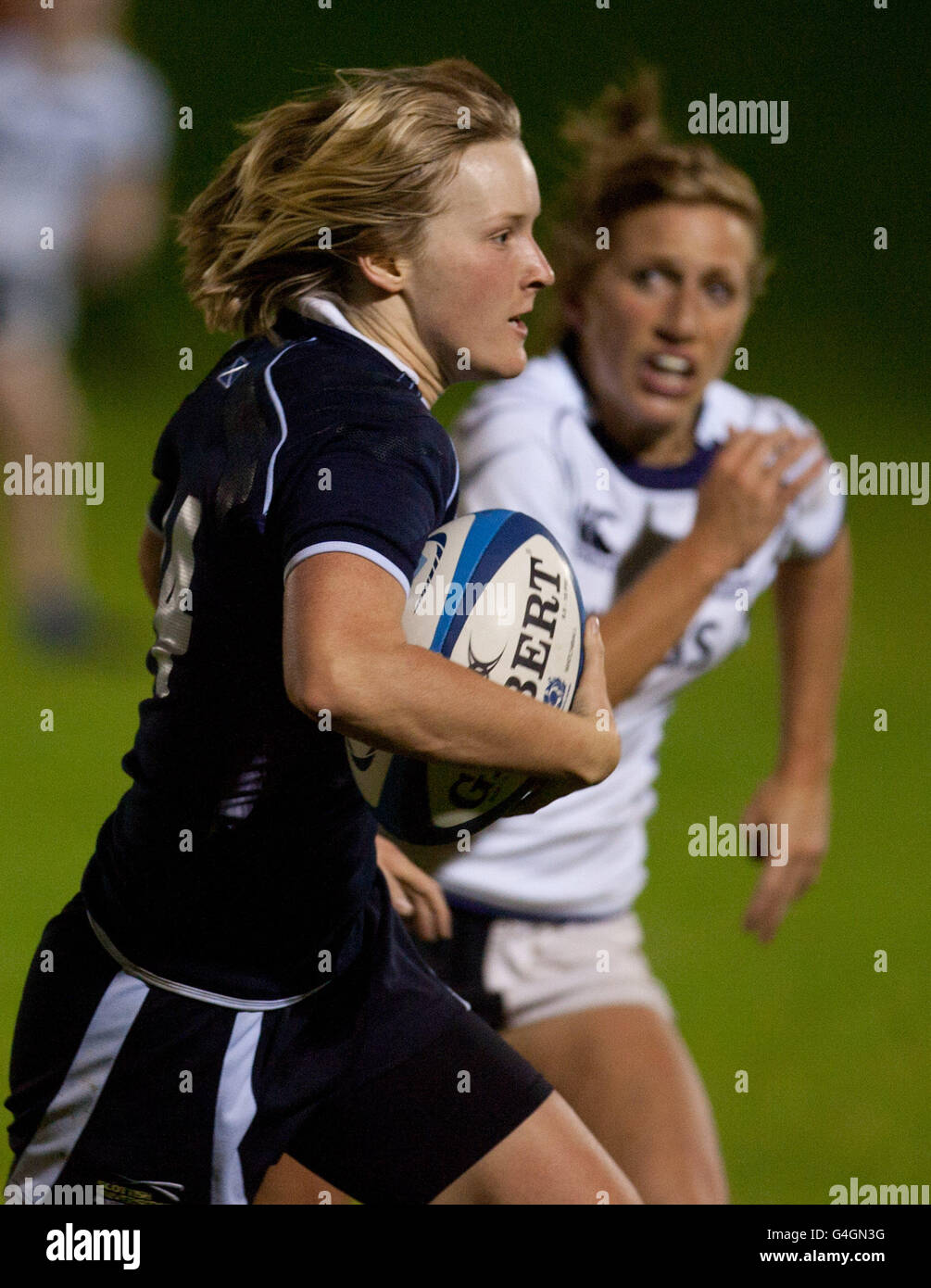 Blues' Lauren Harris breaks away from Whites' Sarah Dixon during the ...