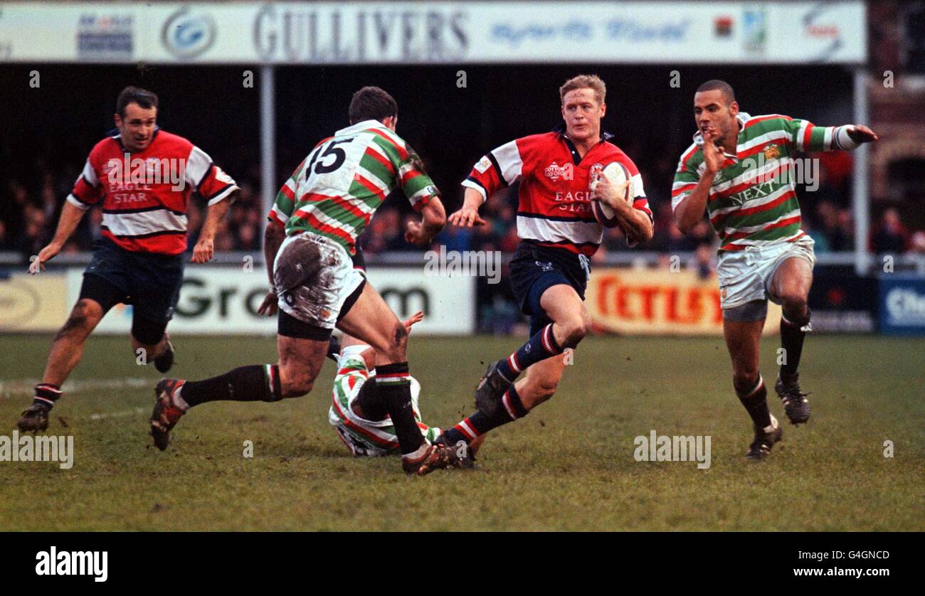 Chris Catling (2nd right) (Gloucester) gets past Leicester's Tim ...