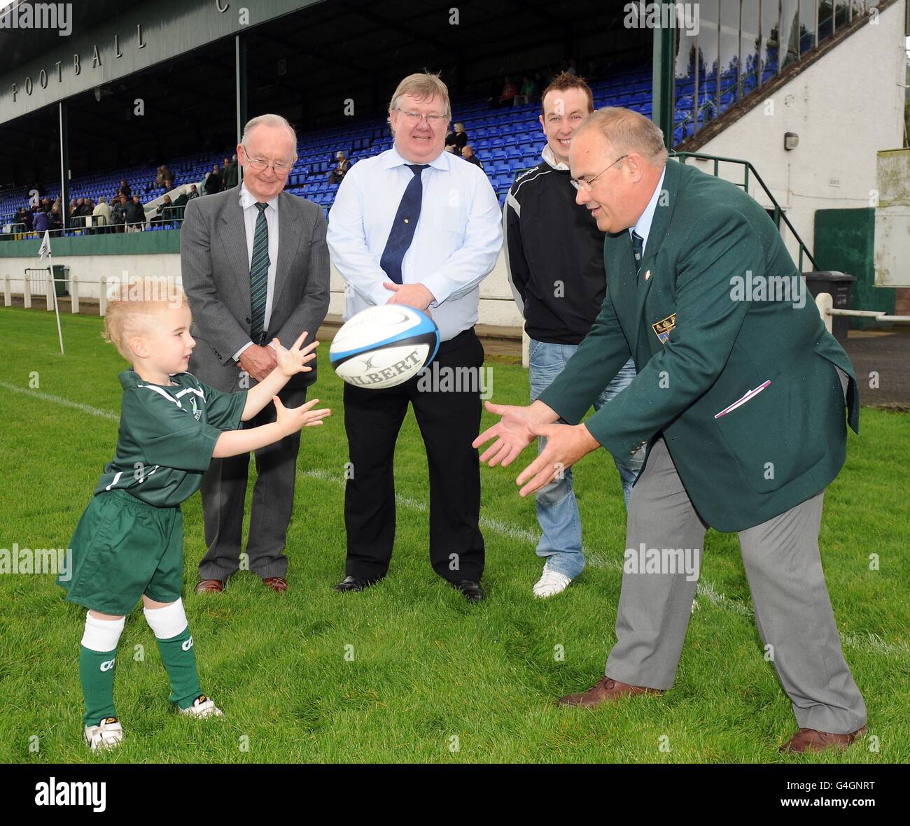 Mascot Coby Scott passes ball to President Alister Pow, there ...