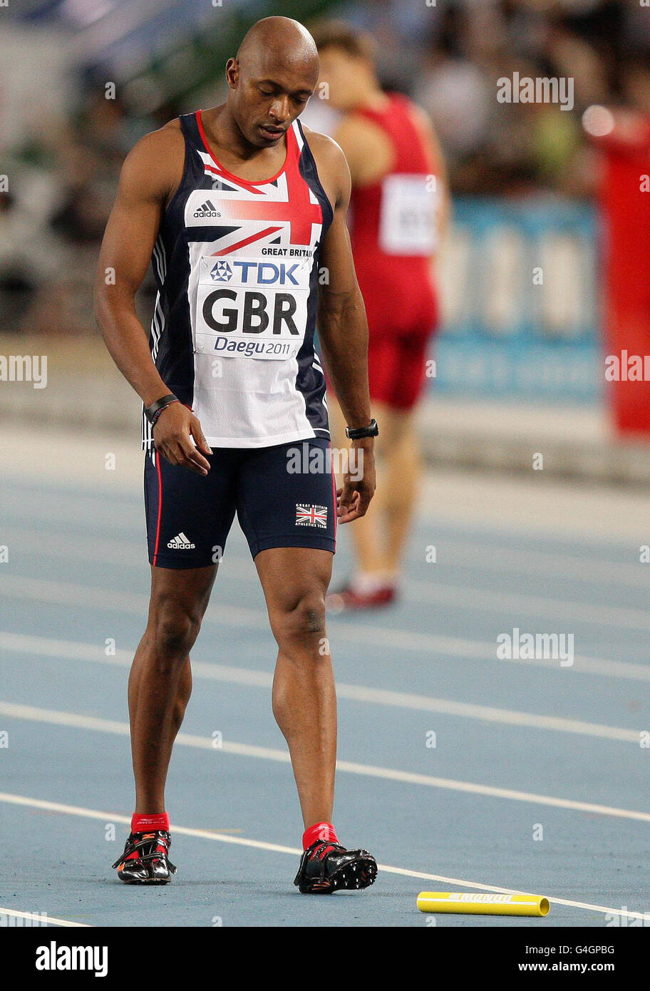 Great Britain's Marlon Devonish returns to pick up the baton that they ...