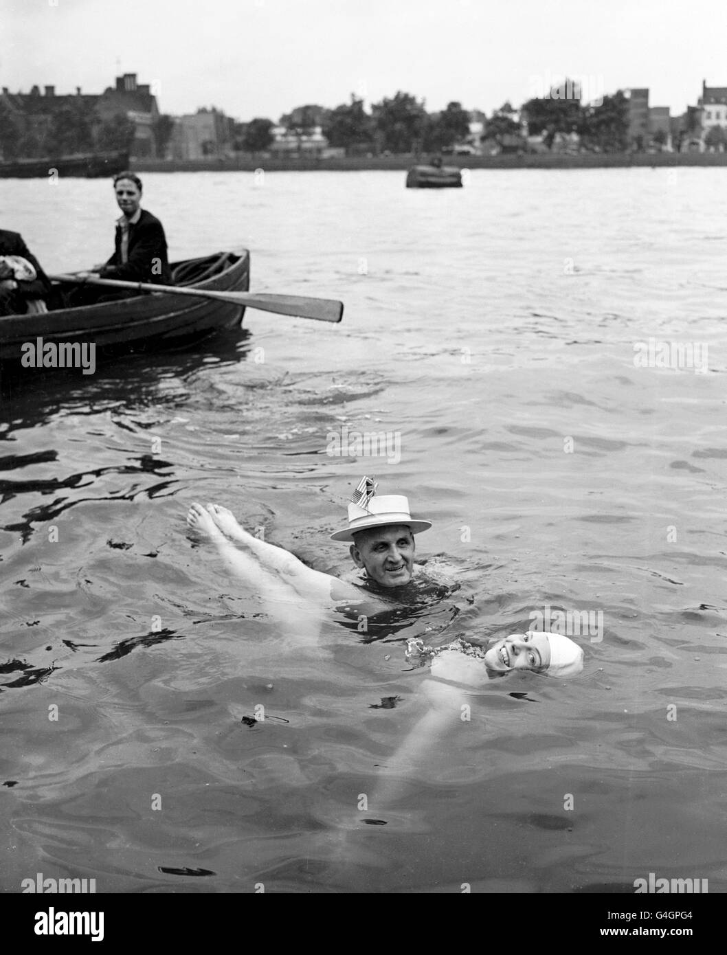 1947 and 1948 Champion Water Walker of the World Joe Simms carries ...
