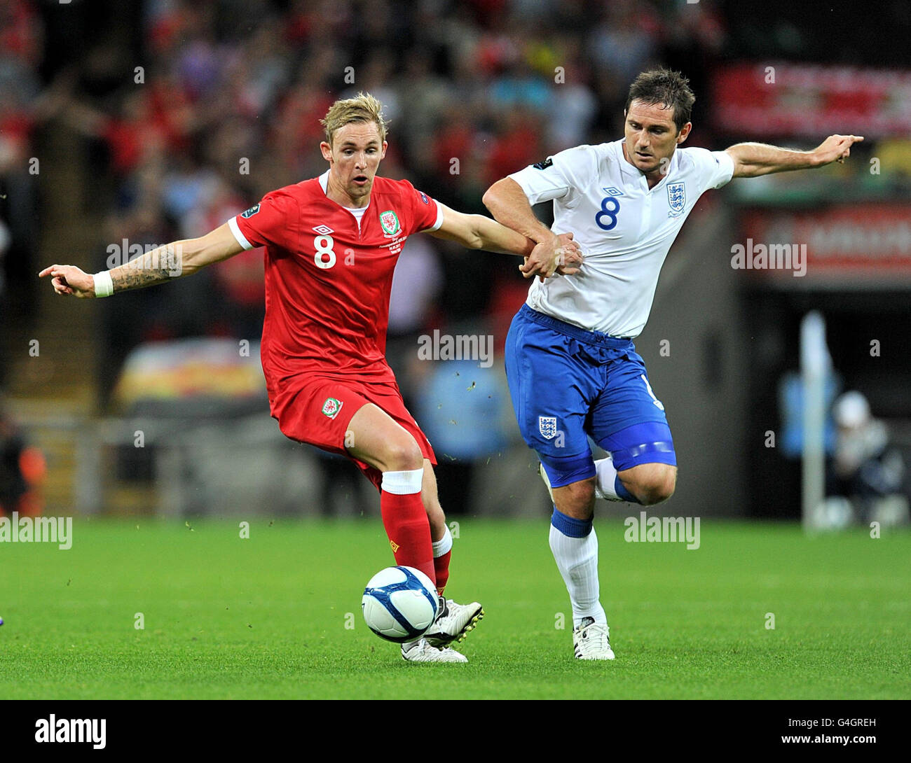 England's Frank Lampard (right) and Wales' Jack Collison battle for the ...