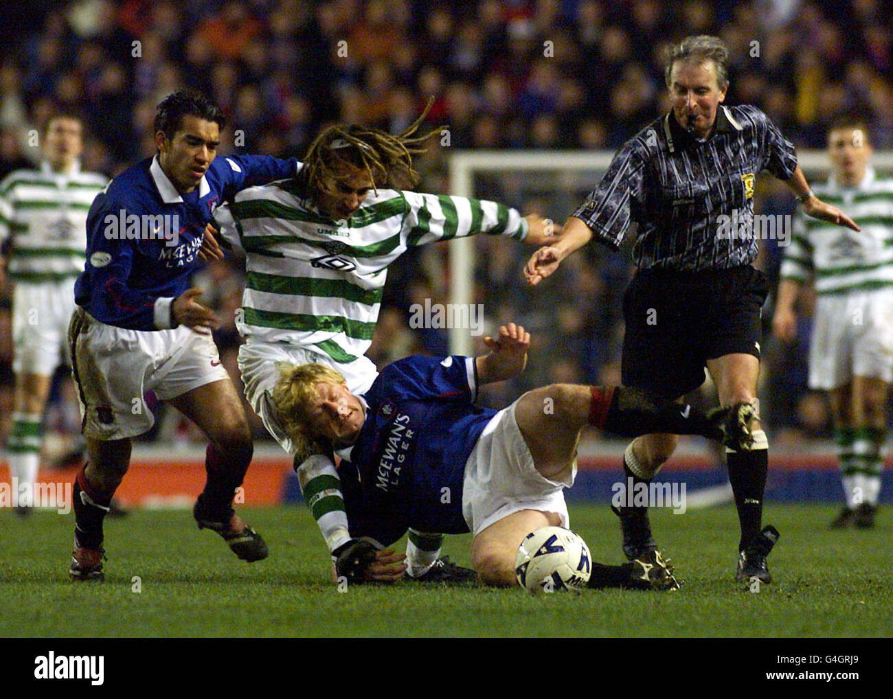 Referee Jim McCluskey blows his whislte as Celtic's Henrik Larsson ...