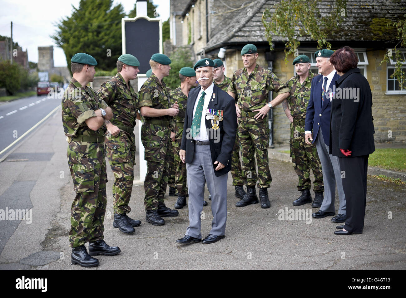 Ex-Royal Marines mingle with serving marines outside the The Chequers ...