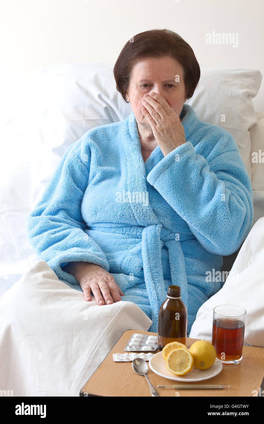 Sick woman in bed Stock Photo - Alamy