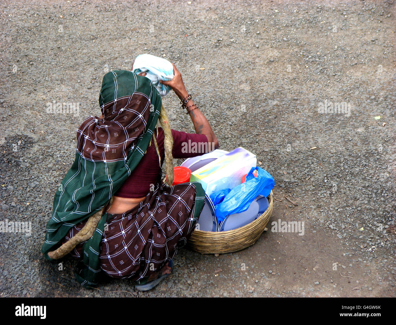 Tired Indian poor woman Stock Photo - Alamy