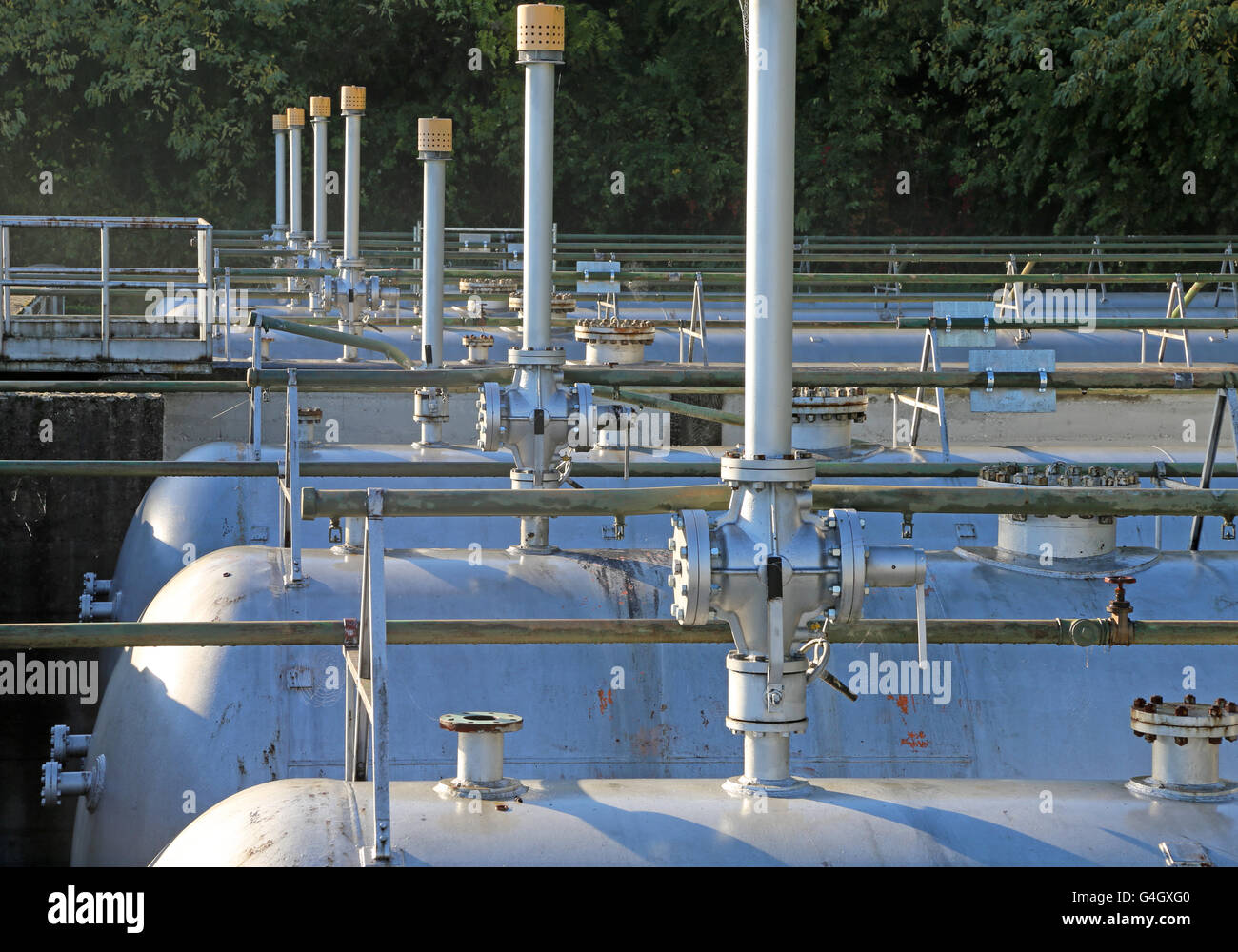 large pipes and safety valve over the gigantic tank for storage of the ...