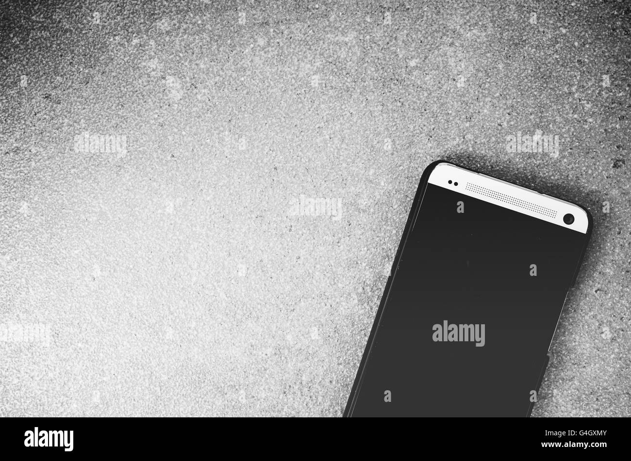 smart phone on a rough stone background - copy space Stock Photo - Alamy