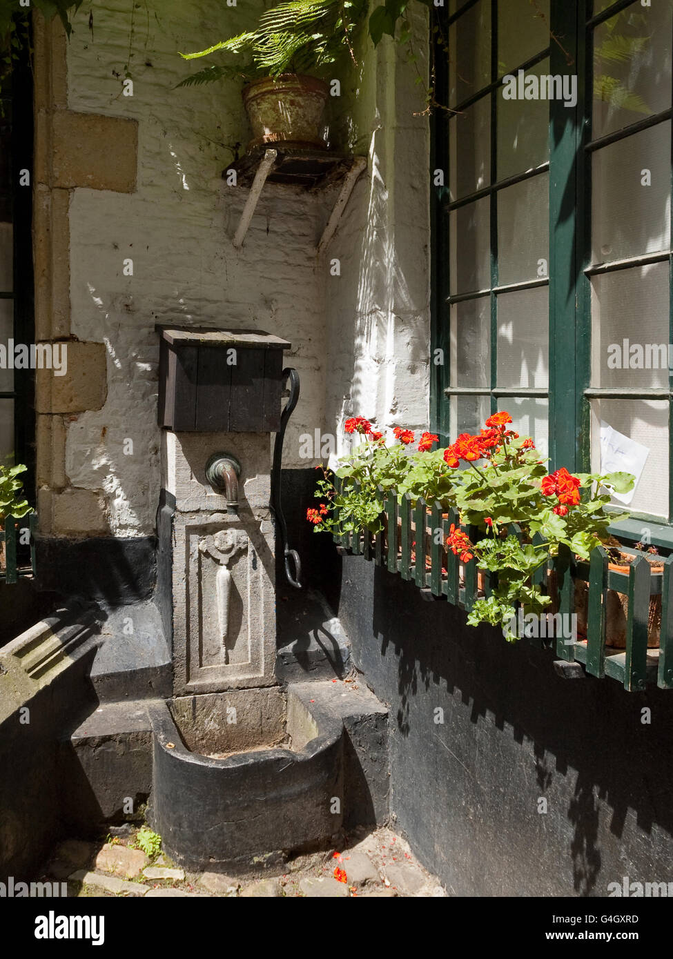 Small medieval alley called Vlaeykensgang in the city centre of Antwerp ...