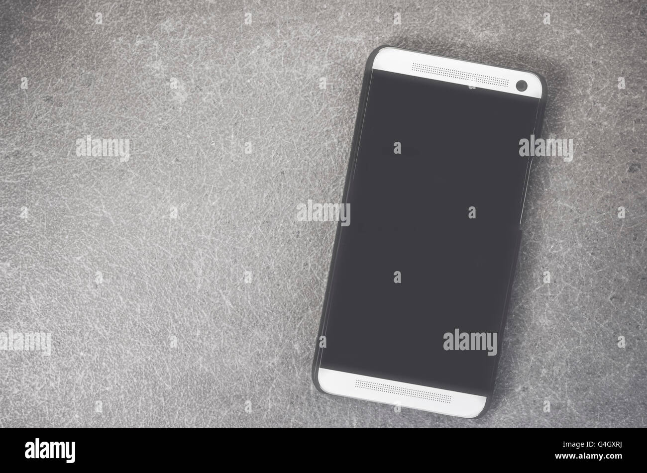 smart phone on a rough stone background - copy space Stock Photo - Alamy