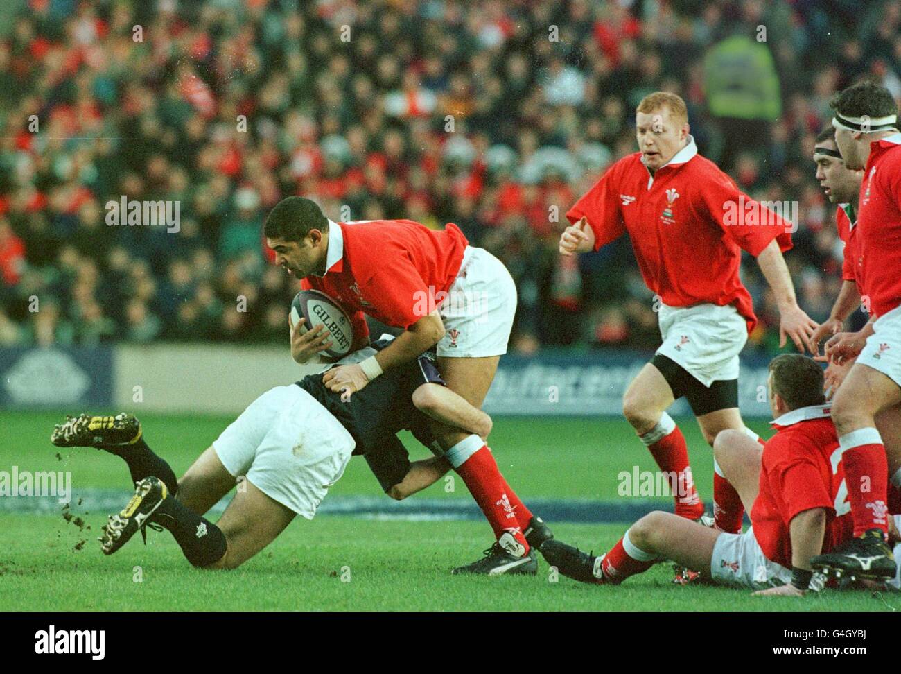 Scotland's Duncan Hodge tackles Wales' Colin Charvis during their Five ...