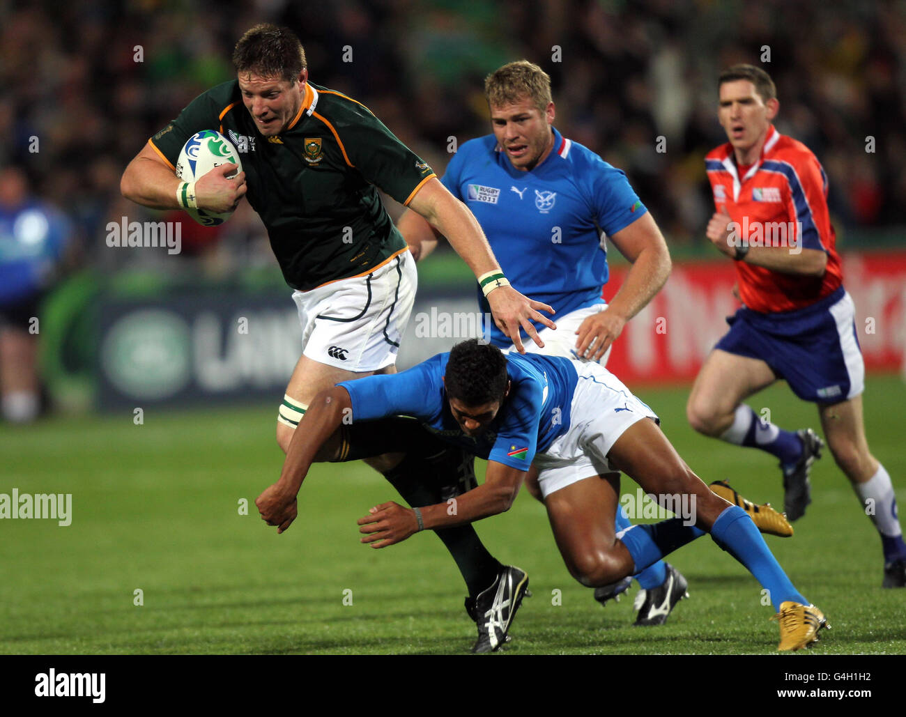 South Africa's Bakkies Botha (left) is tackled by Namibia's Chrysander ...