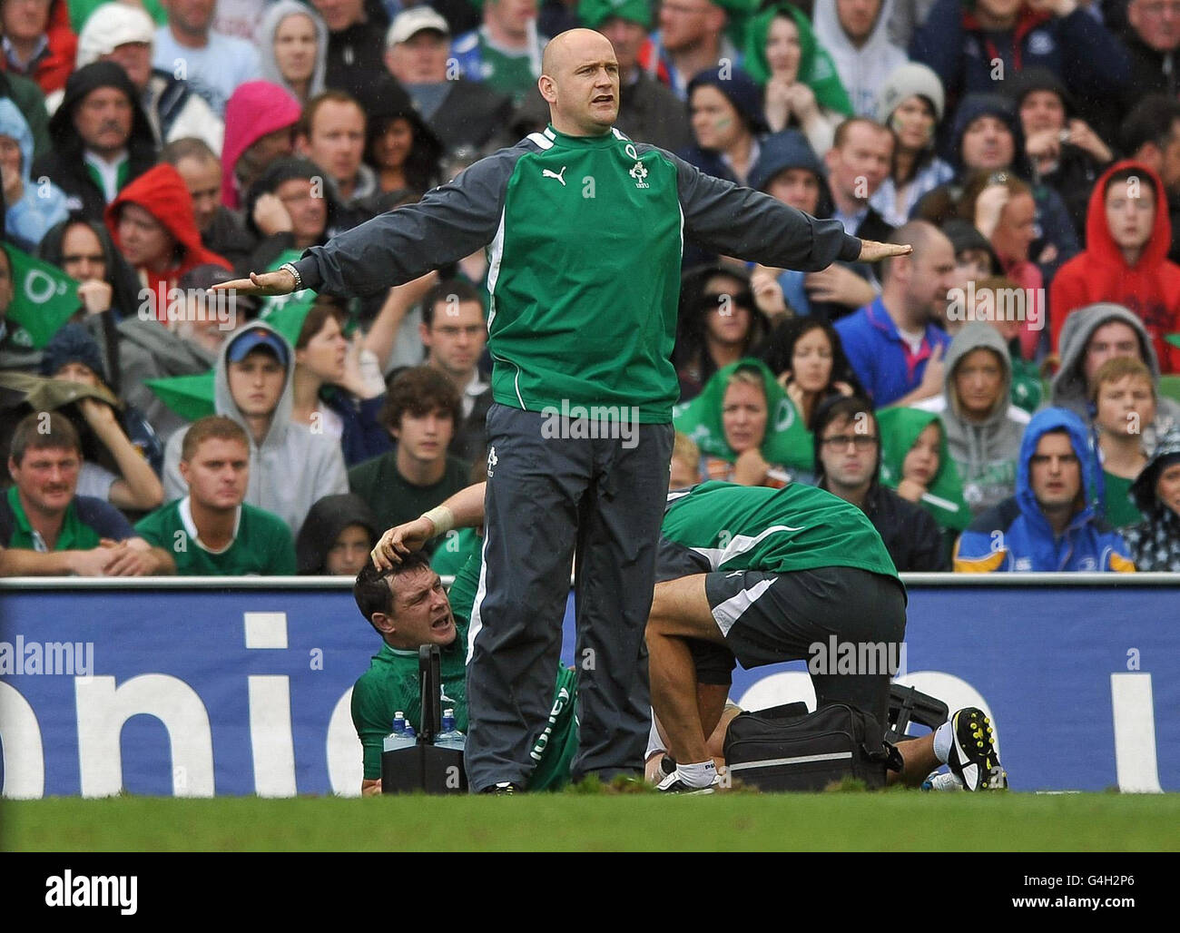 Ireland's David Wallace receives treatment before leaving the field ...