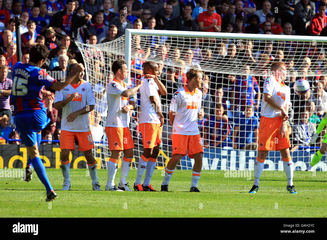 Blackpool's Keith Southern (right) gets the ball in the face directly ...