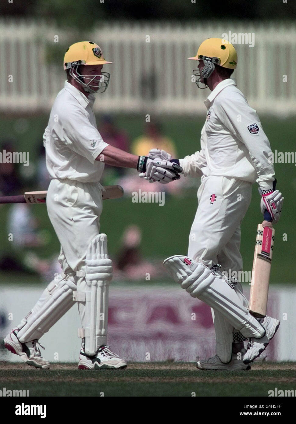 Corey Richards (L) congratulates teammate Greg Blewett after he scores ...
