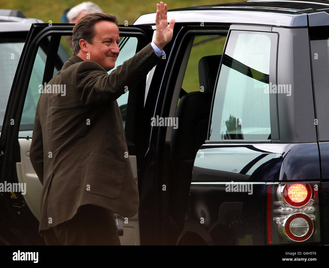 David Cameron waves as he leaves the Braemar Gathering in Braemar. The ...