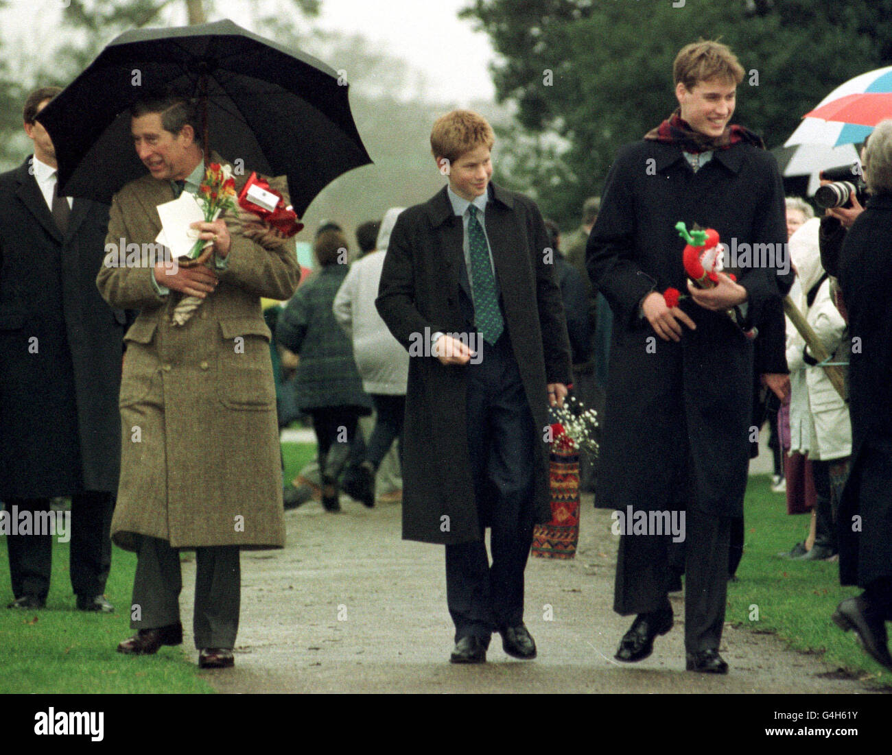 The Prince Of Wales and his sons, Princes William (R) and Harry, carry ...