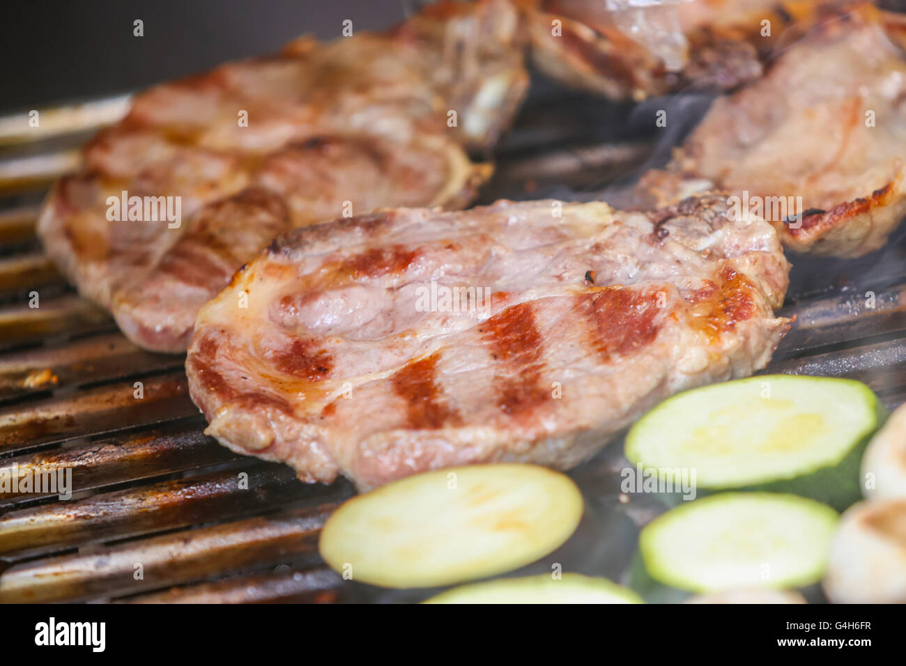Close up of piece of pork meat grilled on the barbecue grid Stock Photo ...