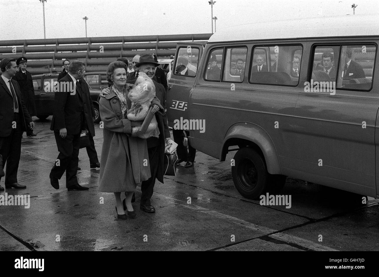 Peter Kroger puts a hand on the shoulder of his wife Helen as they ...