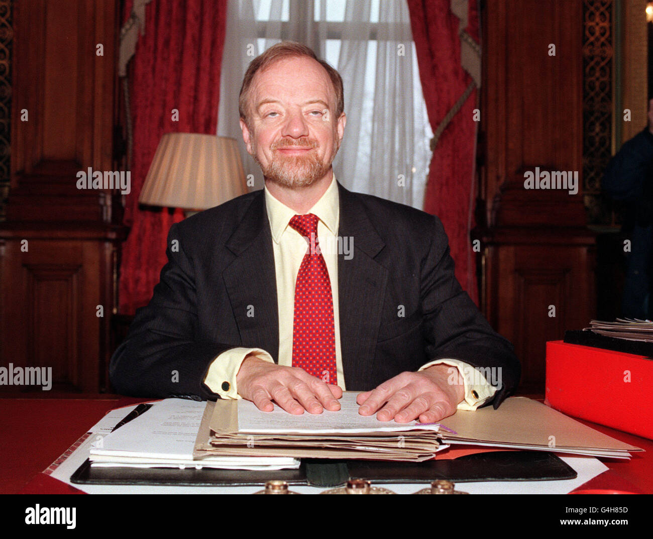 Foreign Secretary Robin Cook at his desk in the Foreign Office ...