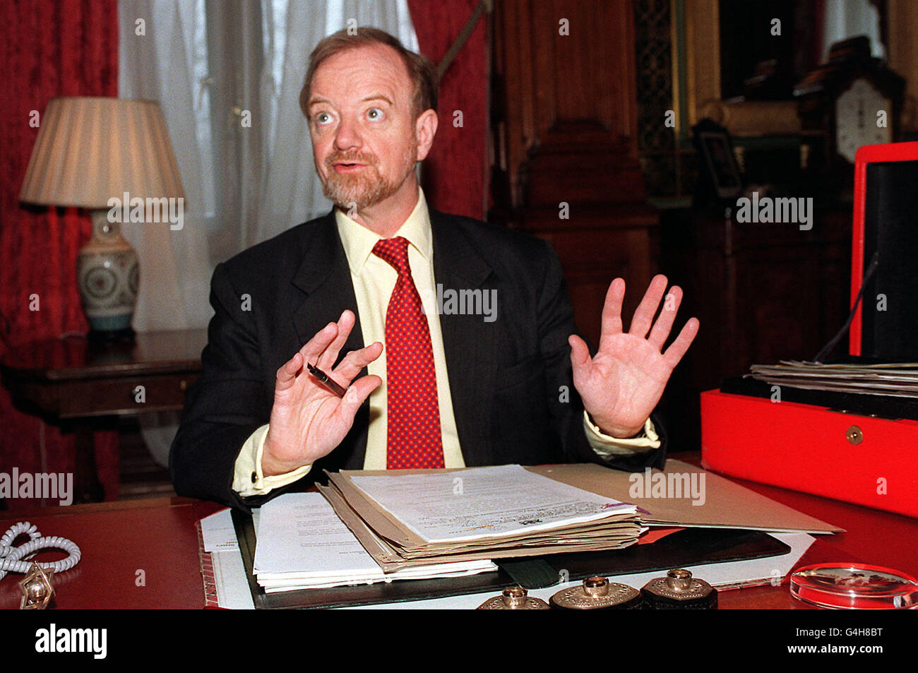 Foreign Secretary Robin Cook at his desk in the Foreign Office ...