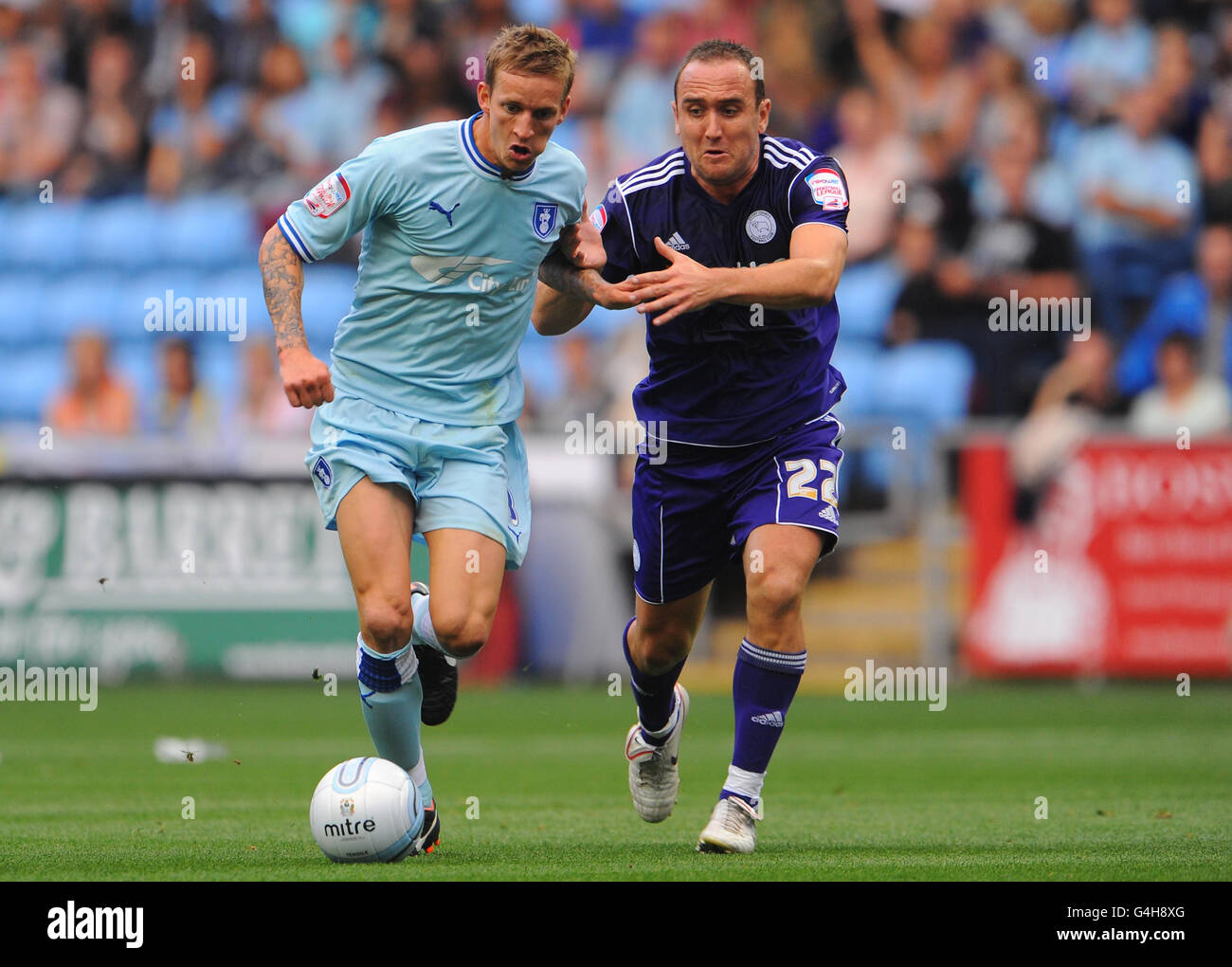 Coventry City's Carl Baker (left) and Derby County's Lee Croft battle ...